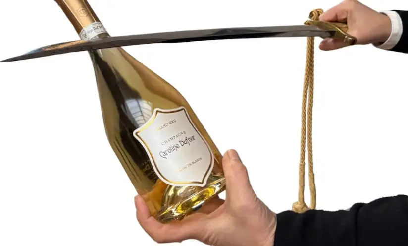 Sabering a bottle of champagne in the heart of Reims
